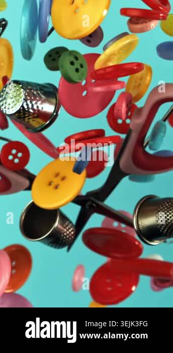 Sewing supplies fly on a blue background. Filmed on a high-speed camera ...