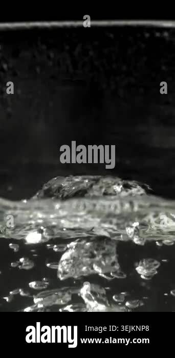 The water boils with air bubbles. Filmed on a high-speed camera at 1000 ...