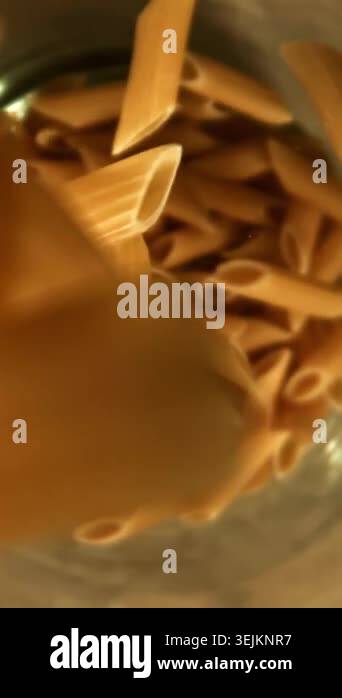 Super slow motion dry penne pasta . Filmed on a high-speed camera at ...