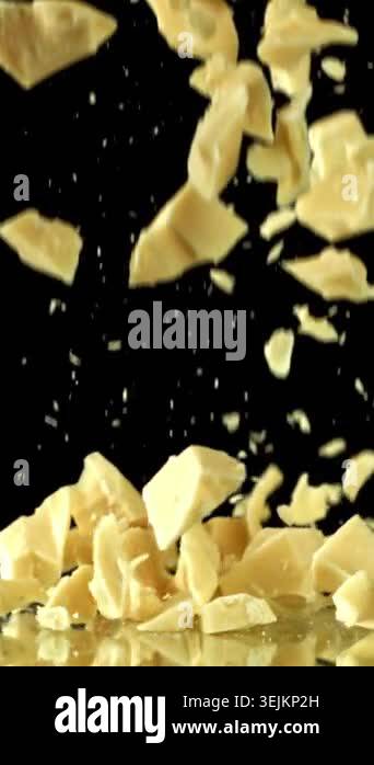 Super slow motion Pieces of white chocolate . Filmed on a high-speed ...