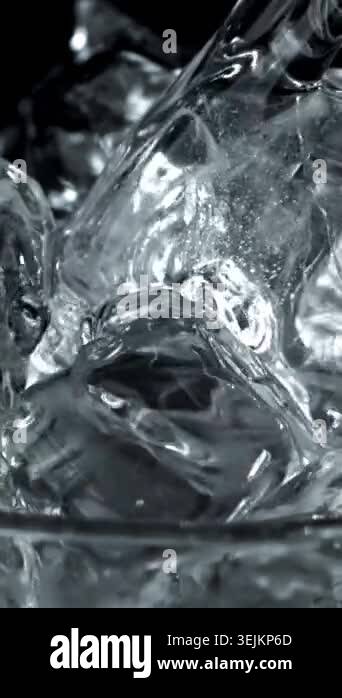 Vodka with ice. Filmed on a high-speed camera at 1000 fps. High quality ...