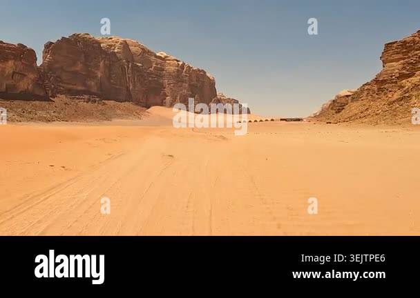 Aerial view of red sand dunes and sandstone rock formations with a ...