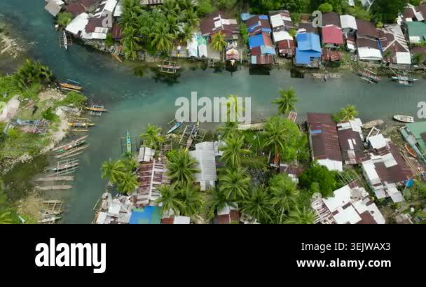 Aerial survey of traditional fishing boat and fishermen village. Cold ...