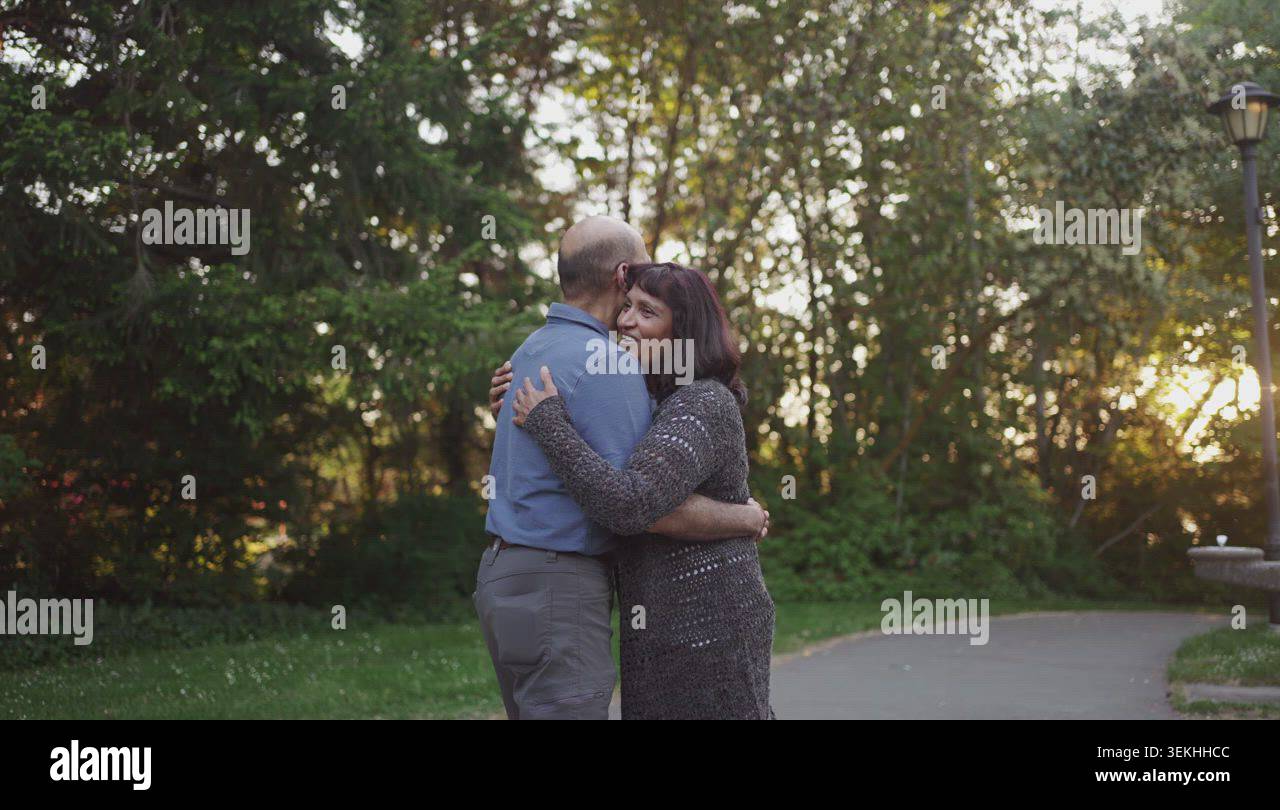 Romantic couple dancing and connecting outside in park Stock Video ...