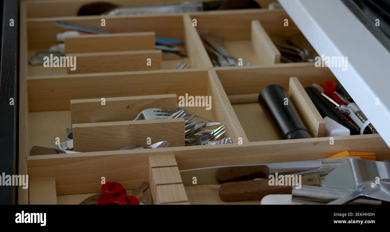 Woman arranging spoons in the drawer Stock Video Footage - Alamy
