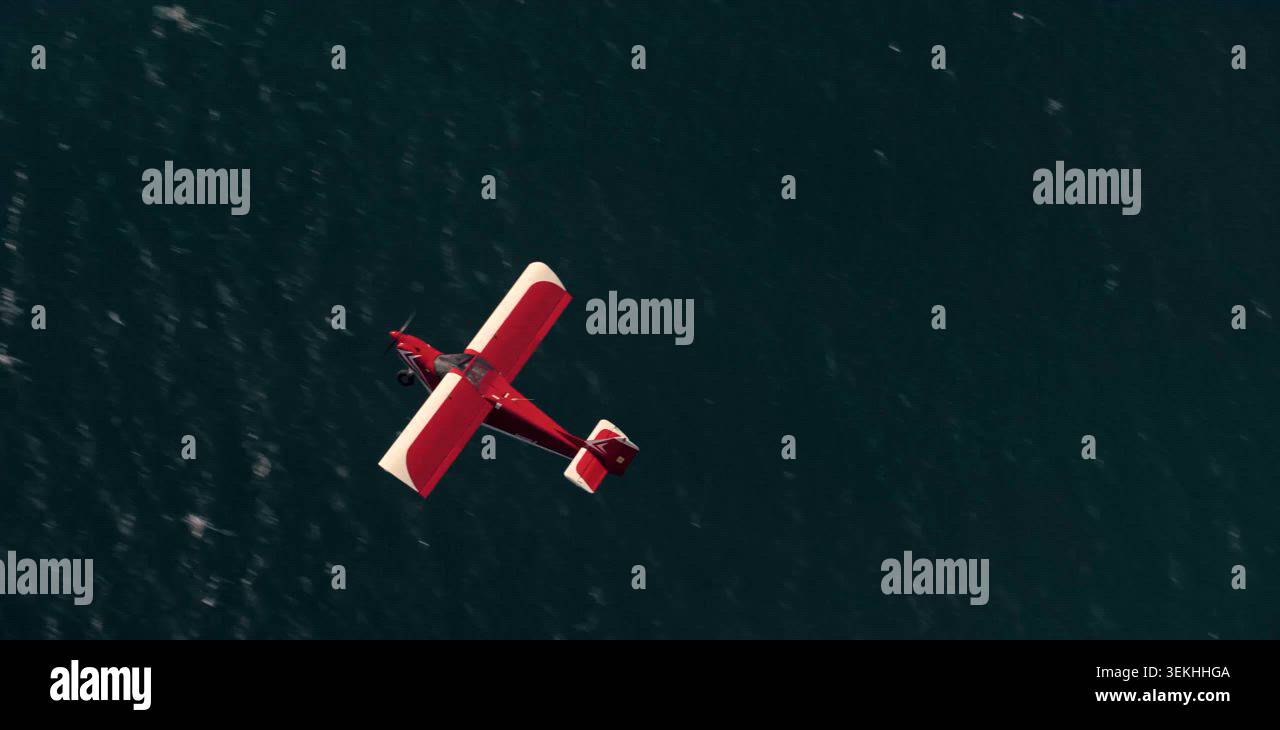 Small red and white plane flies above the sea Stock Video Footage - Alamy