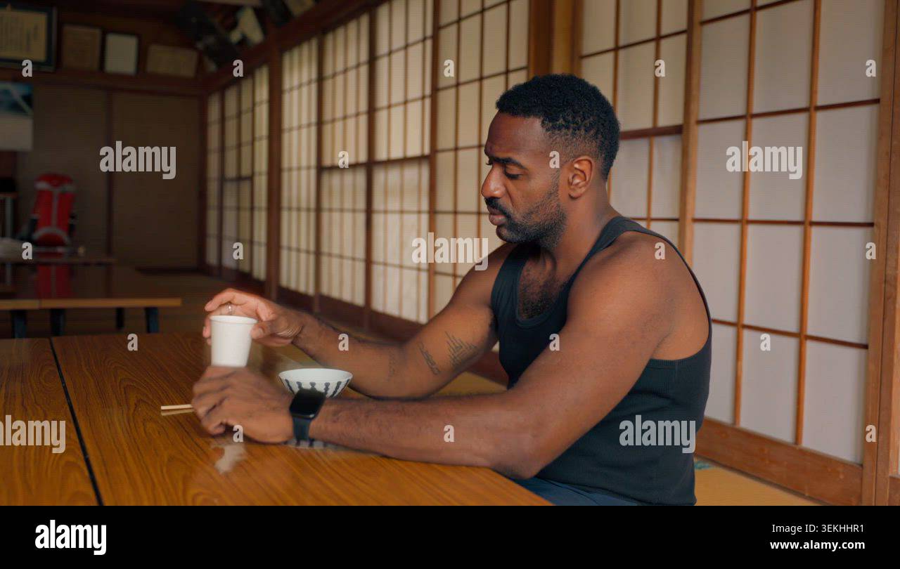 Man drinking from cup in tatami room Stock Video Footage - Alamy