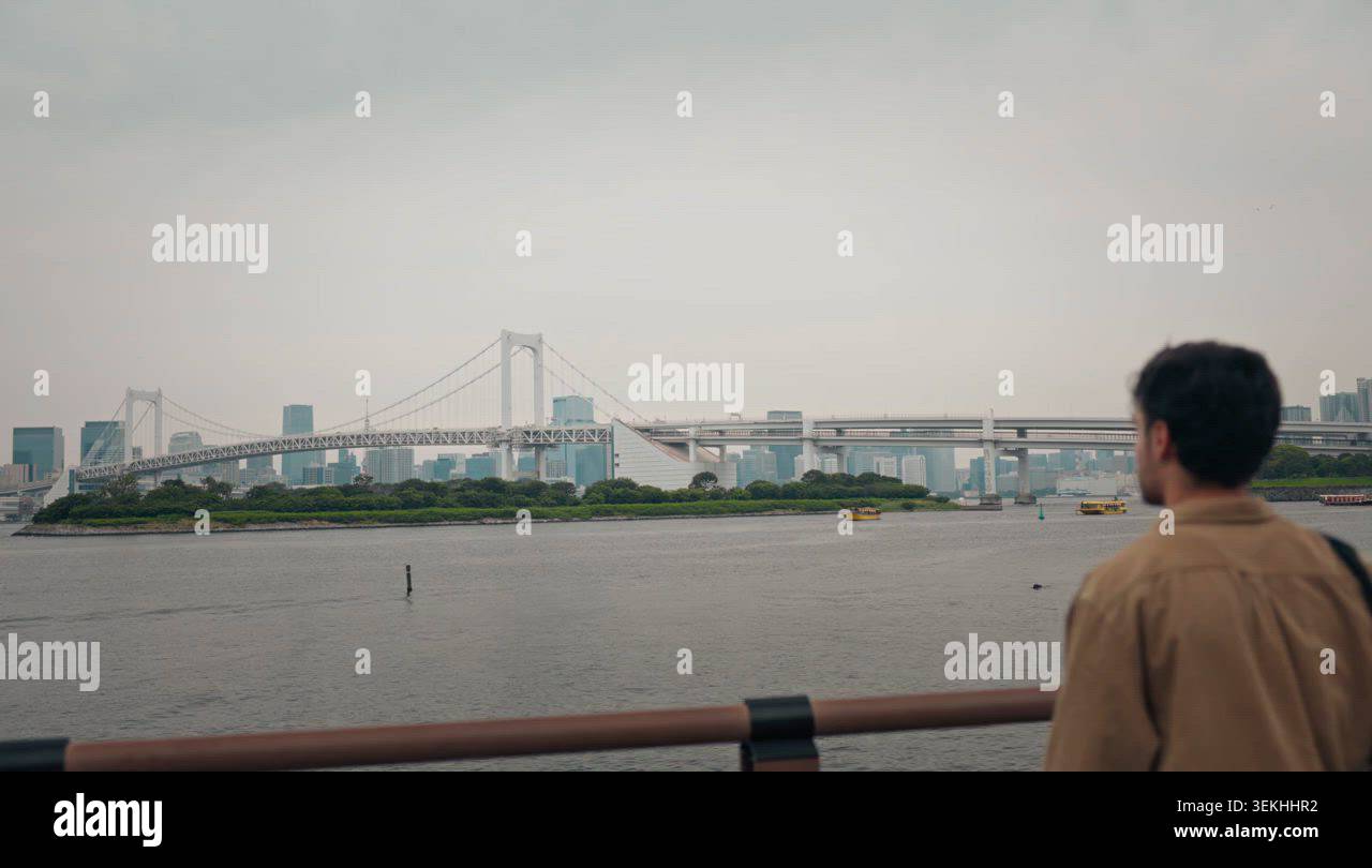 Tourist watching Rainbow Bridge over Tokyo Bay Stock Video Footage - Alamy