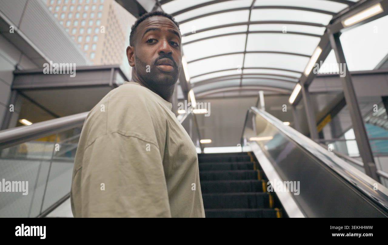Man on escalator in modern Tokyo station Stock Video Footage - Alamy