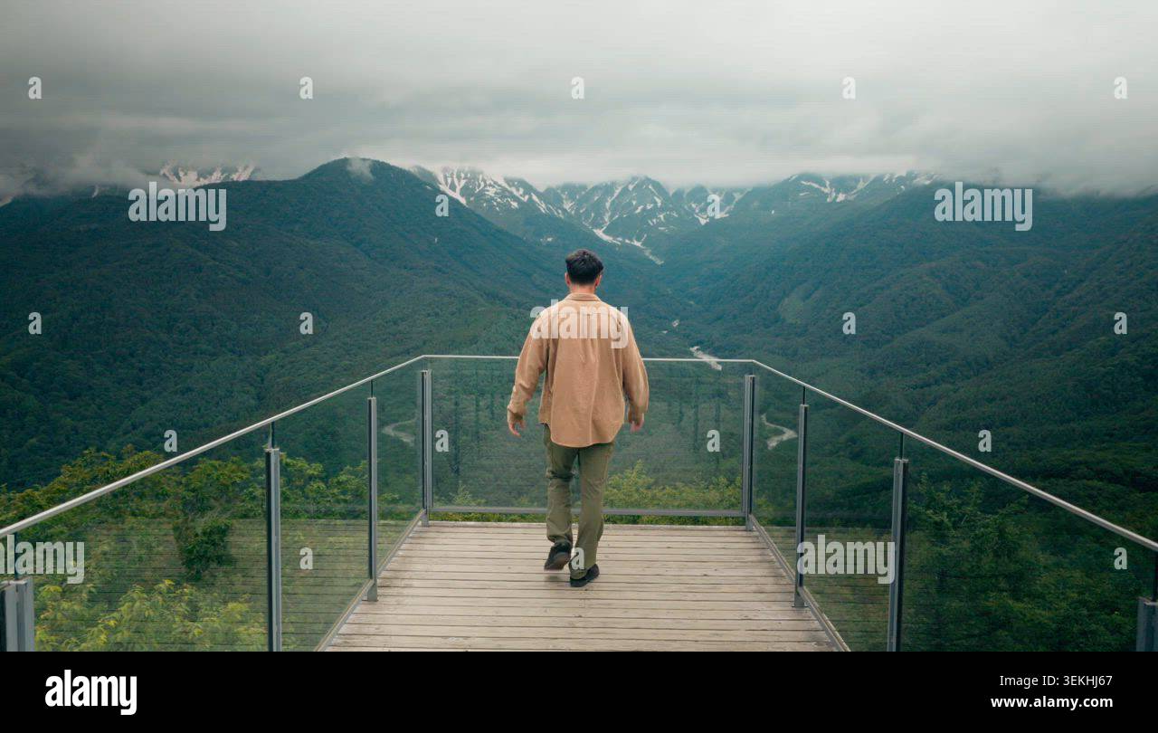 Traveler overlooking Hakuba Valley Stock Video Footage - Alamy