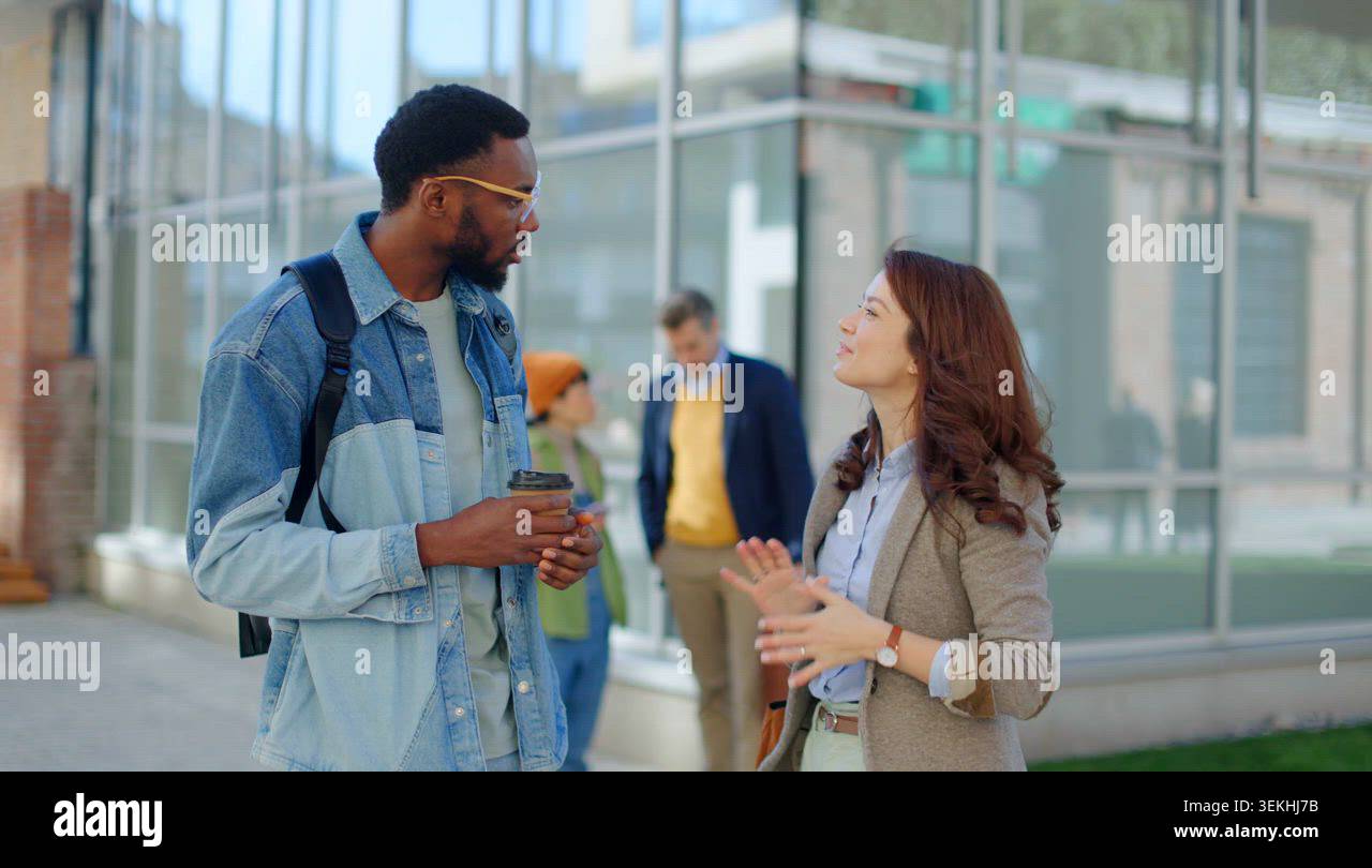 Professionals having conversation outside Stock Video Footage - Alamy