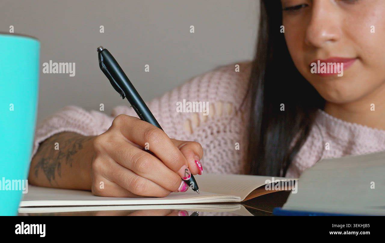 Student writing notes at home Stock Video Footage - Alamy