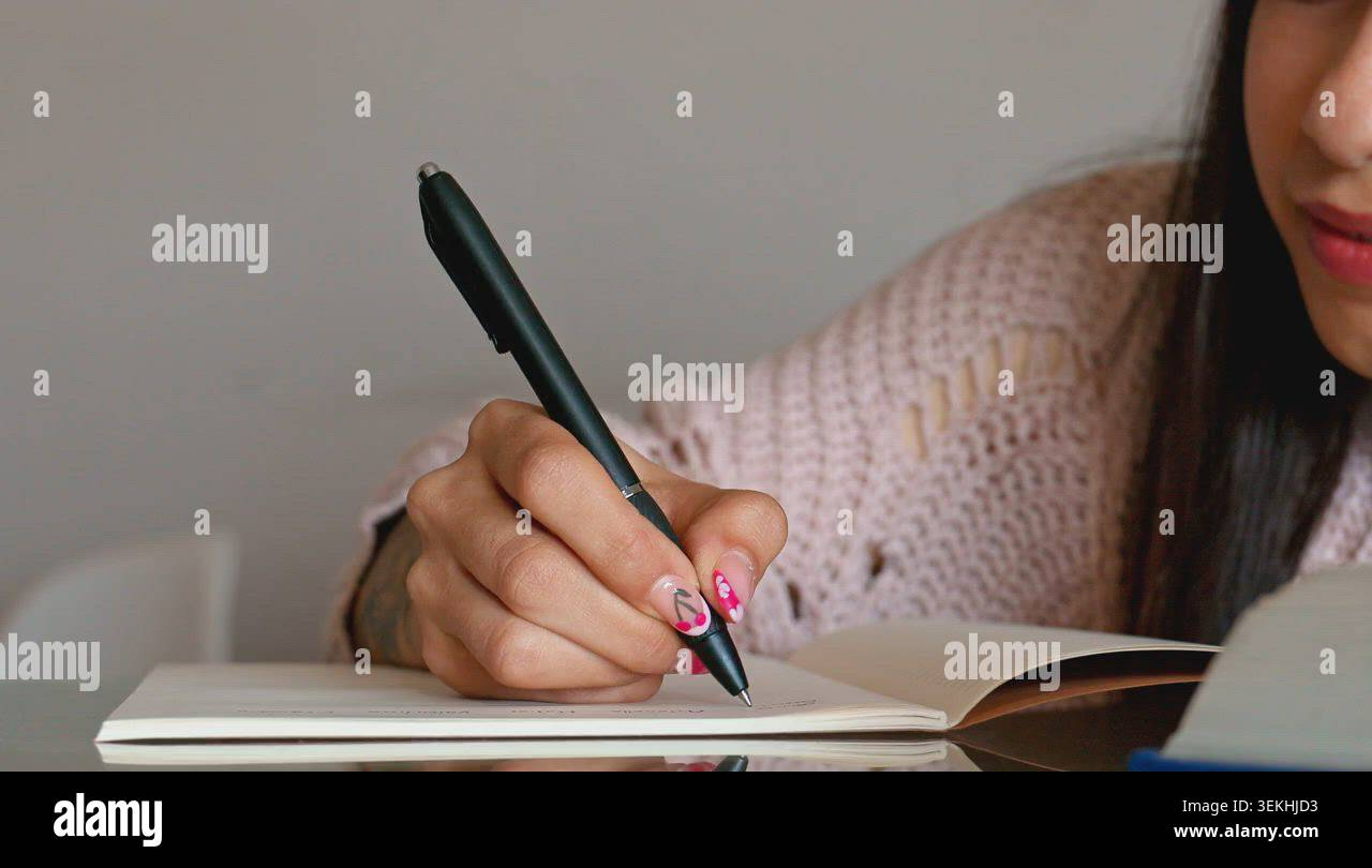 Young student woman writing notes Stock Video Footage - Alamy