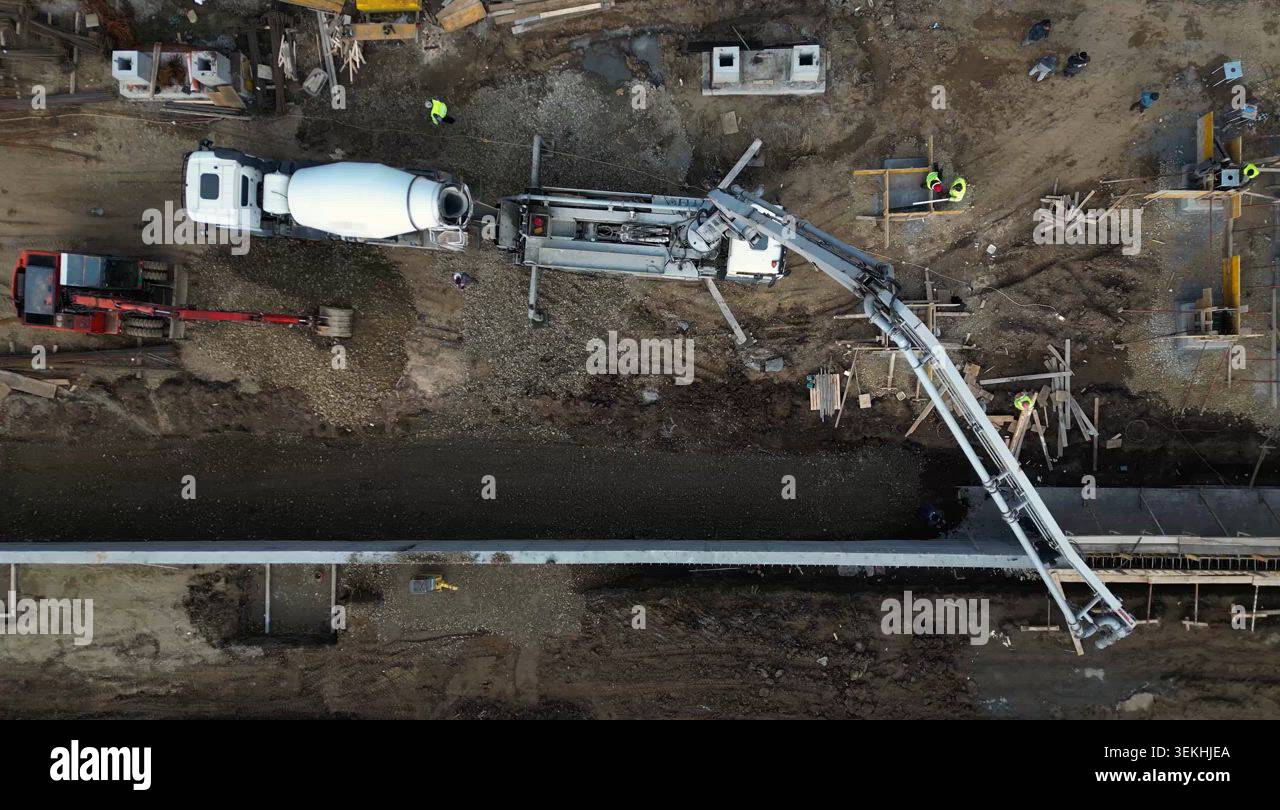 Concrete Pump and Mixer Truck Pouring Concrete Stock Video Footage - Alamy