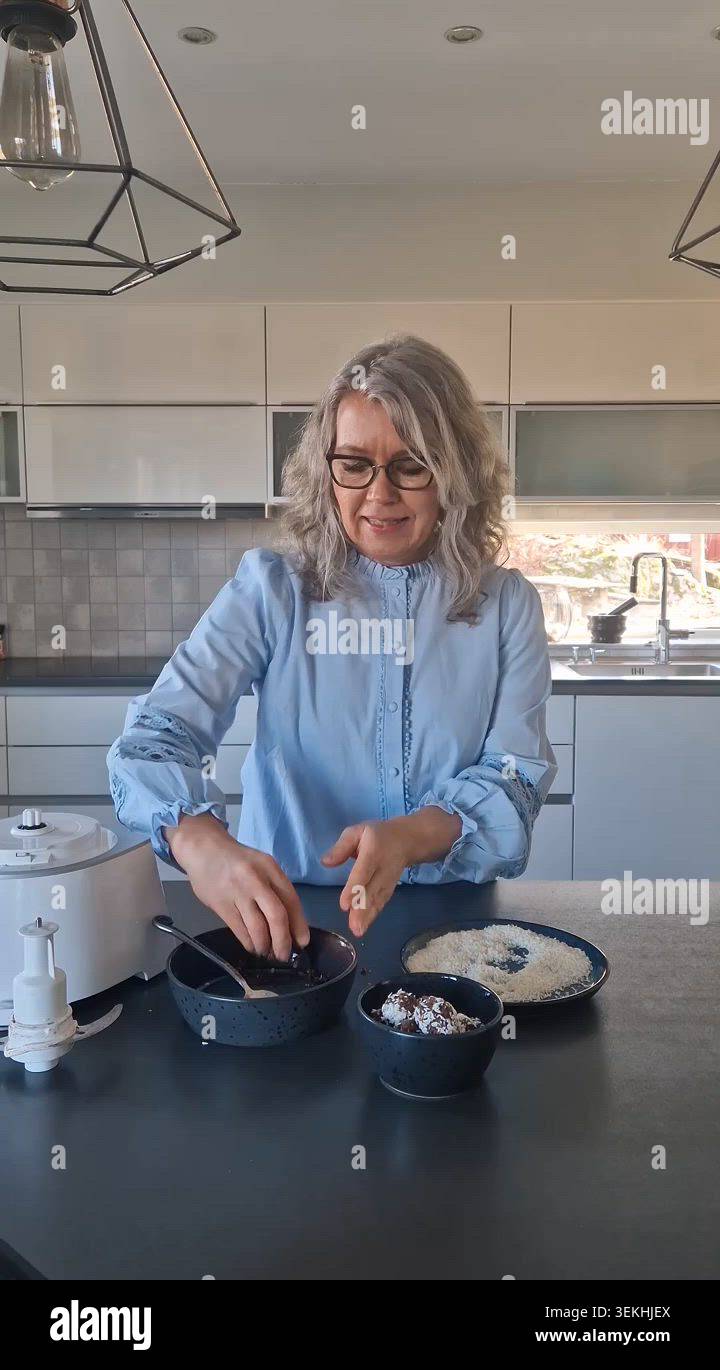 Middle-Aged Woman Making Healthy Raw Chocolate Energy Balls Stock Video ...