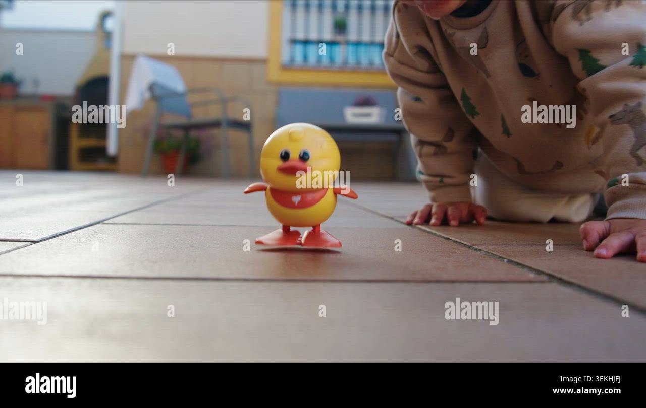 Toddler Playing With Yellow Duck Stock Video Footage - Alamy