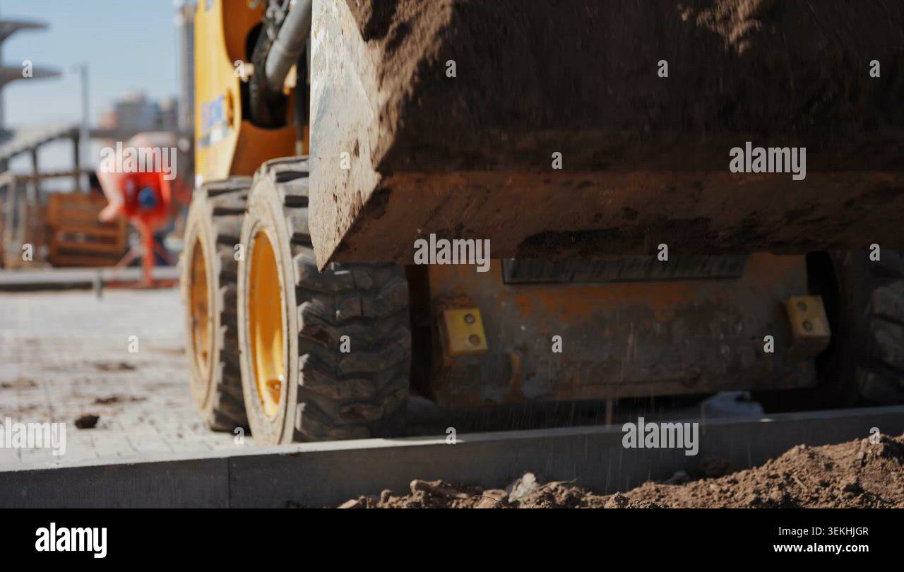 Soil Dumping From Loader Bucket On Site Stock Video Footage - Alamy