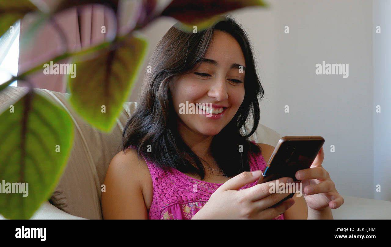 Using Smartphone on Sofa Stock Video Footage - Alamy