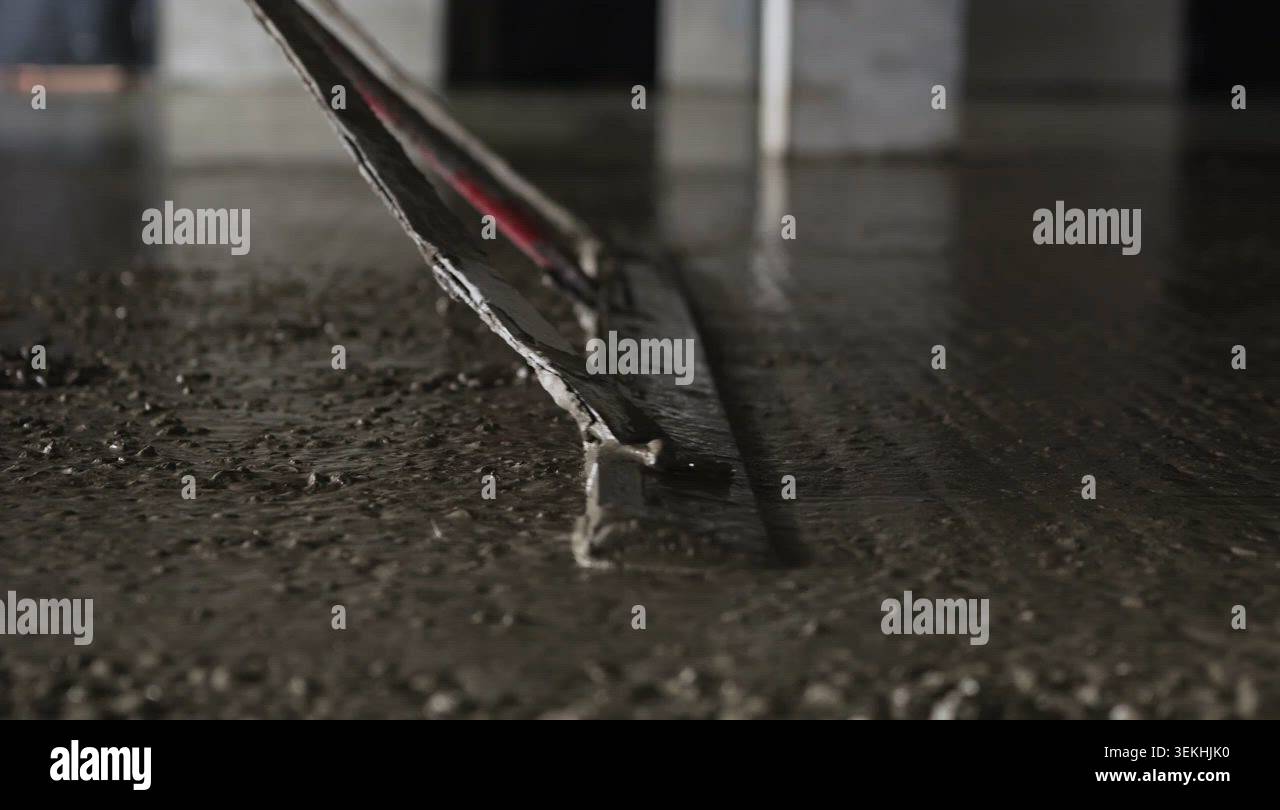 Smoothing Concrete Surface With Screed Tool Stock Video Footage - Alamy