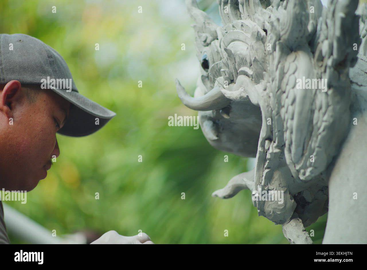 6K open gate: Thai artisan sculpting naga cement sculpture Stock Video ...