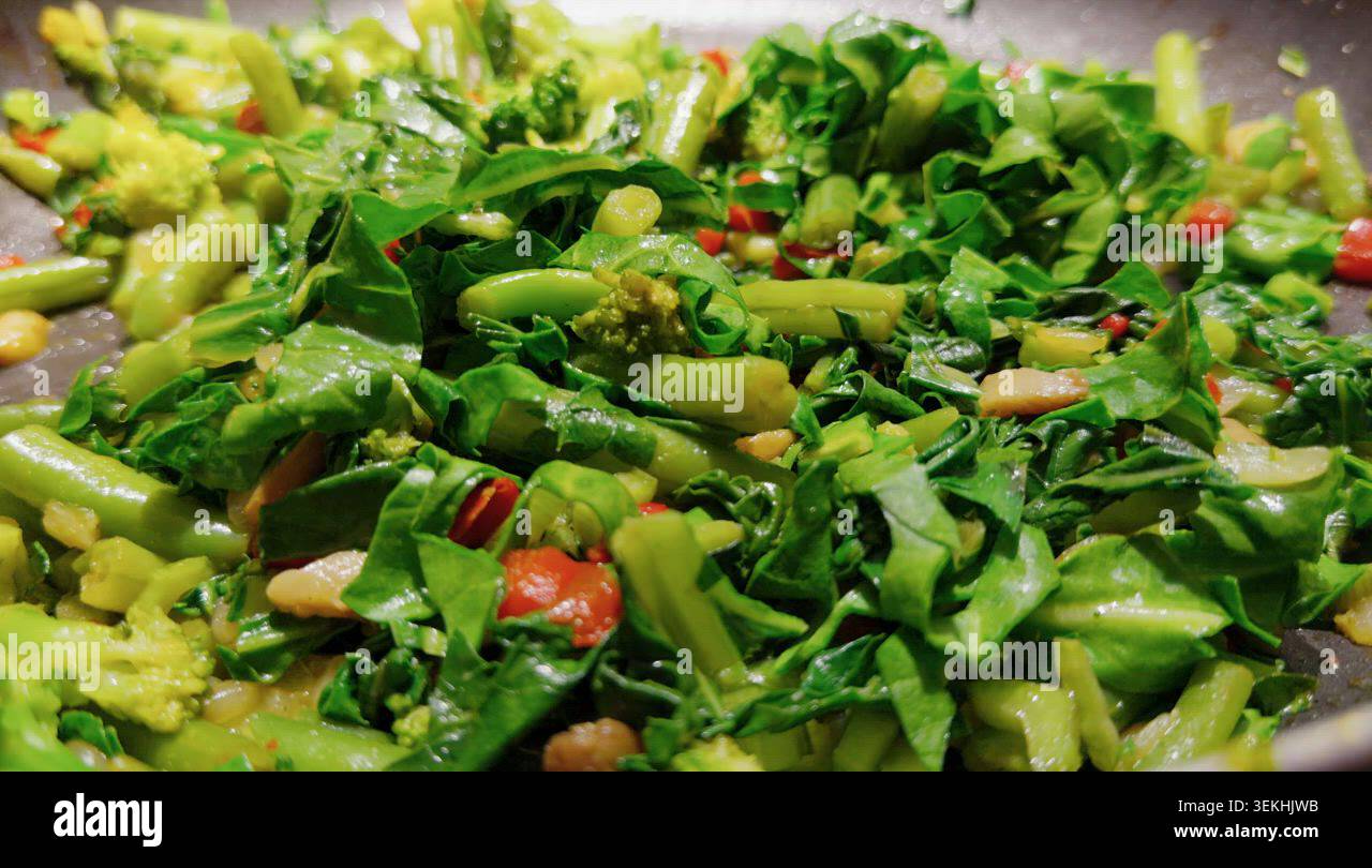 Cooking vibrant vegetables in pan Stock Video Footage - Alamy