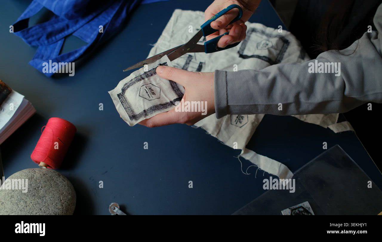 The designer creates labels for his clothes Stock Video Footage - Alamy
