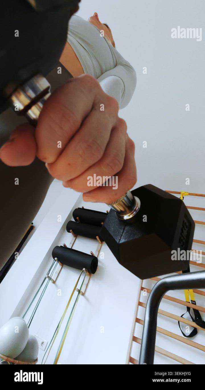 POV Shot of Hand Lifting Dumbbell Stock Video Footage - Alamy