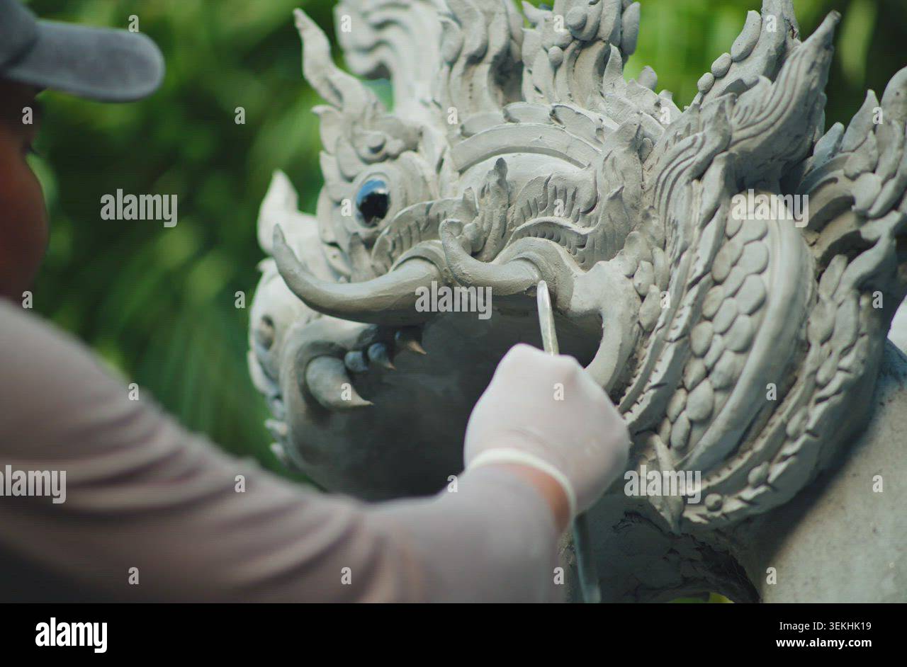 6K open gate: Thai artisan sculpting naga cement sculpture Stock Video ...