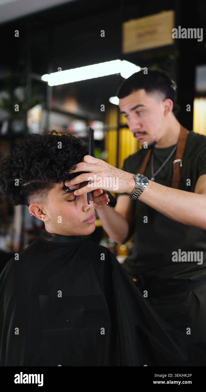 Barber cuts client's hair Stock Video Footage - Alamy