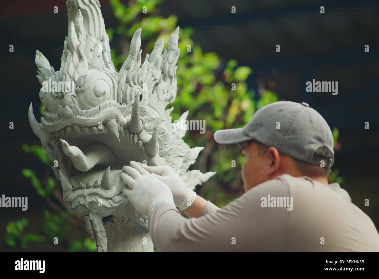 6K open gate: Thai artisan sculpting naga cement sculpture Stock Video ...