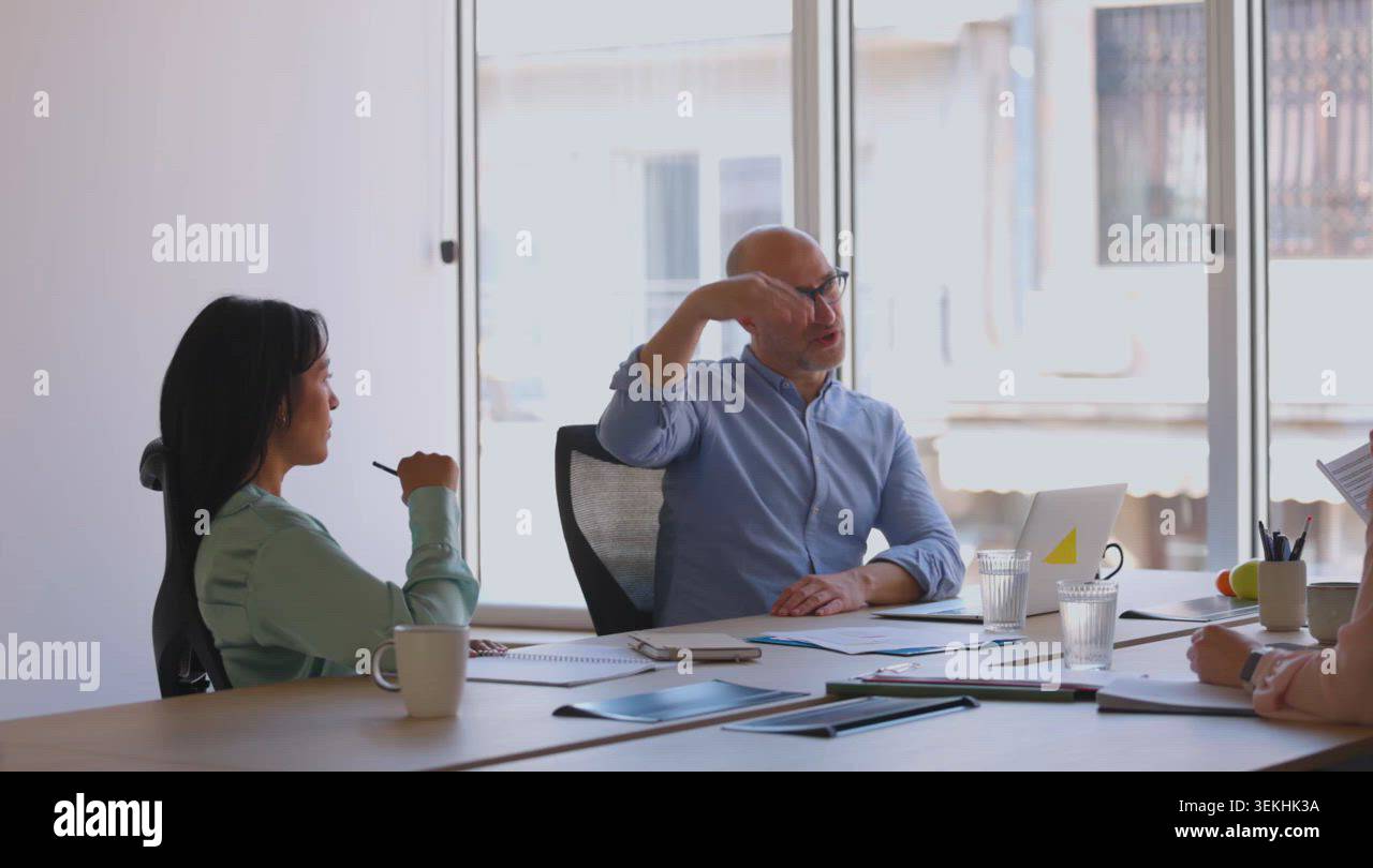 The manager holds a meeting with the team Stock Video Footage - Alamy