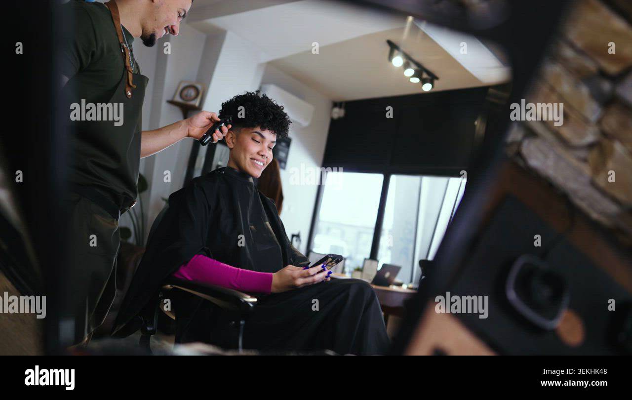 Stylist cuts hair in a salon Stock Video Footage - Alamy