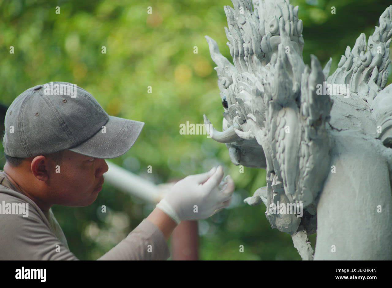 6K open gate: Thai artisan sculpting naga cement sculpture Stock Video ...