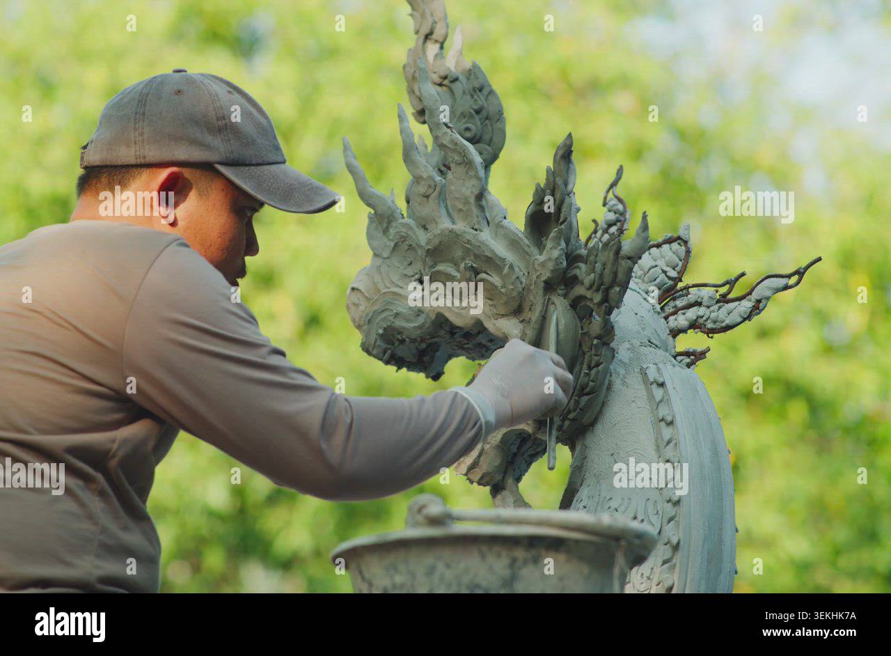 6K open gate: Thai artisan sculpting naga cement sculpture Stock Video ...