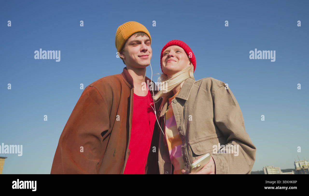 Couple Dancing, Listening Music, Using Phone Together In Blue Sky Stock ...