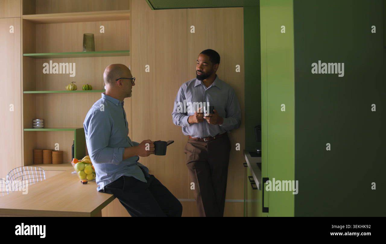 Coworkers chat in the company canteen Stock Video Footage - Alamy