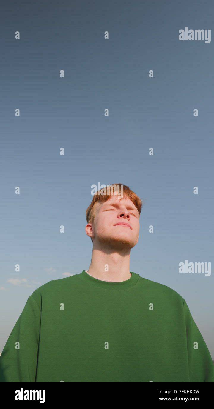 Man Enjoys Sunlight Under Clear Blue Sky Stock Video Footage - Alamy