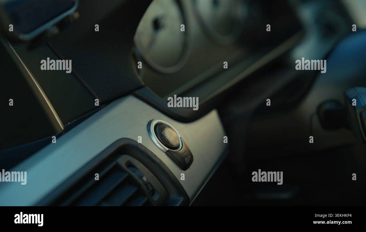 pressing push to start button to start car engine Stock Video Footage ...