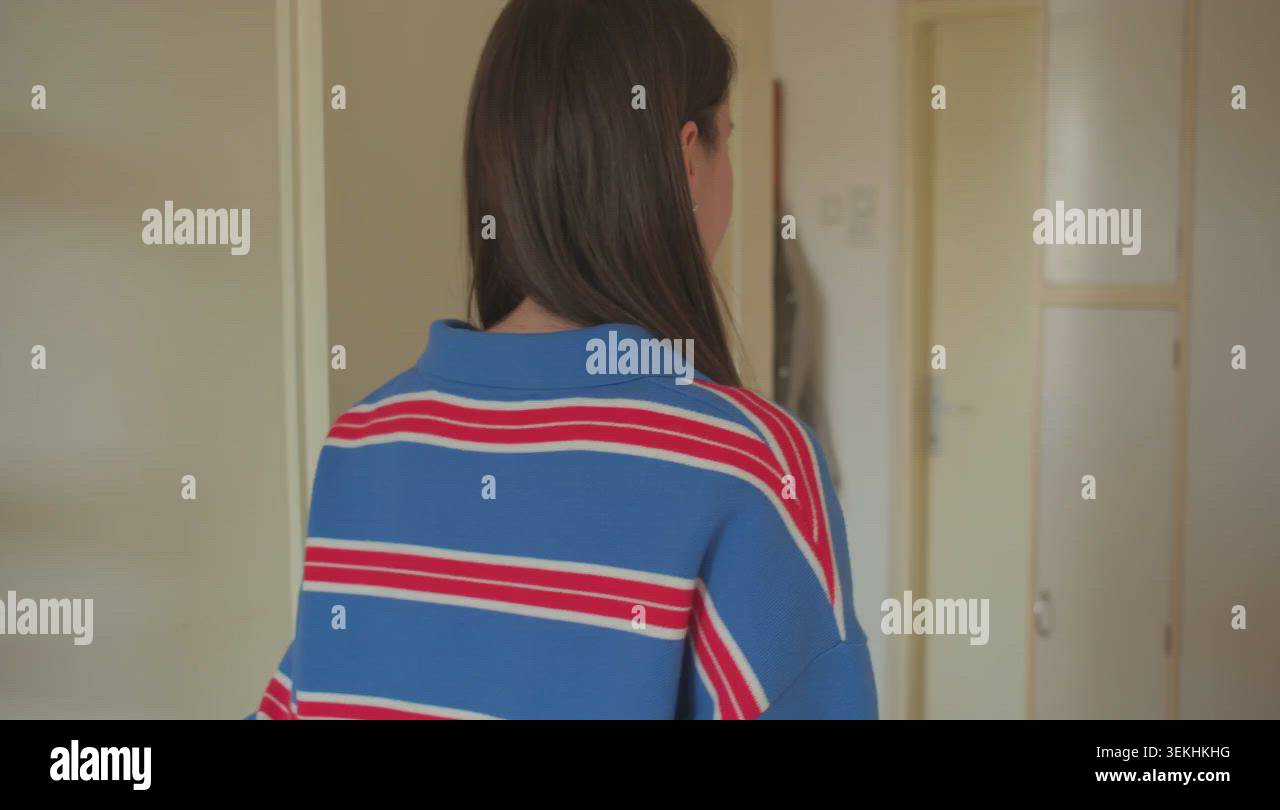 Woman walking indoors seen from behind Stock Video Footage - Alamy