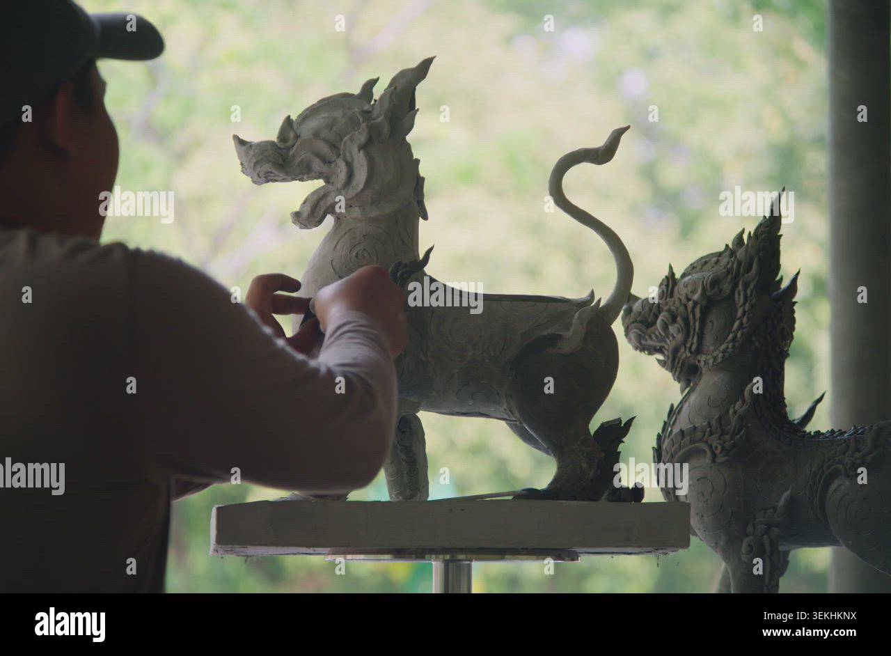 6K open gate: artisan inspecting singha cement sculpture Stock Video ...