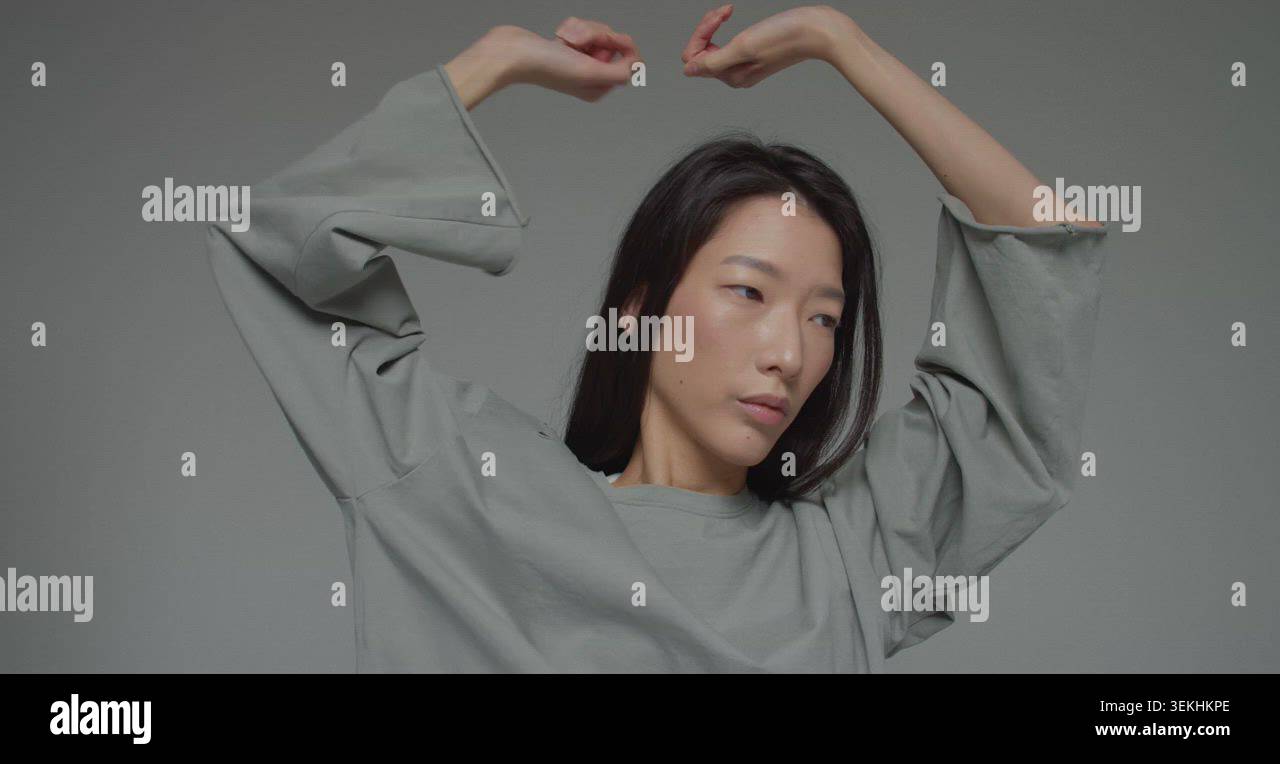 Person with long hair dancing gracefully in studio Stock Video Footage ...