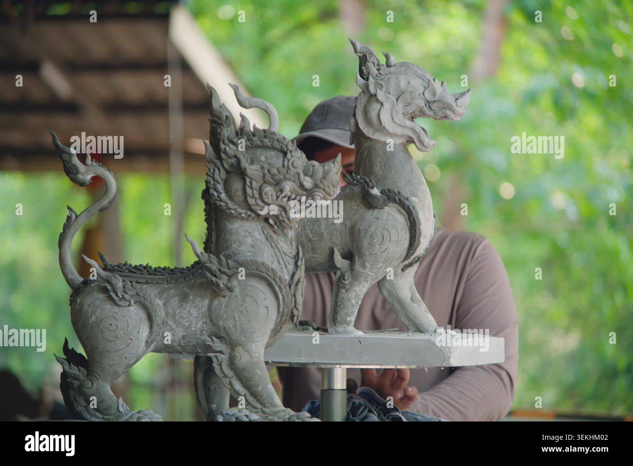 6K open gate: artisan inspecting singha cement sculpture Stock Video ...