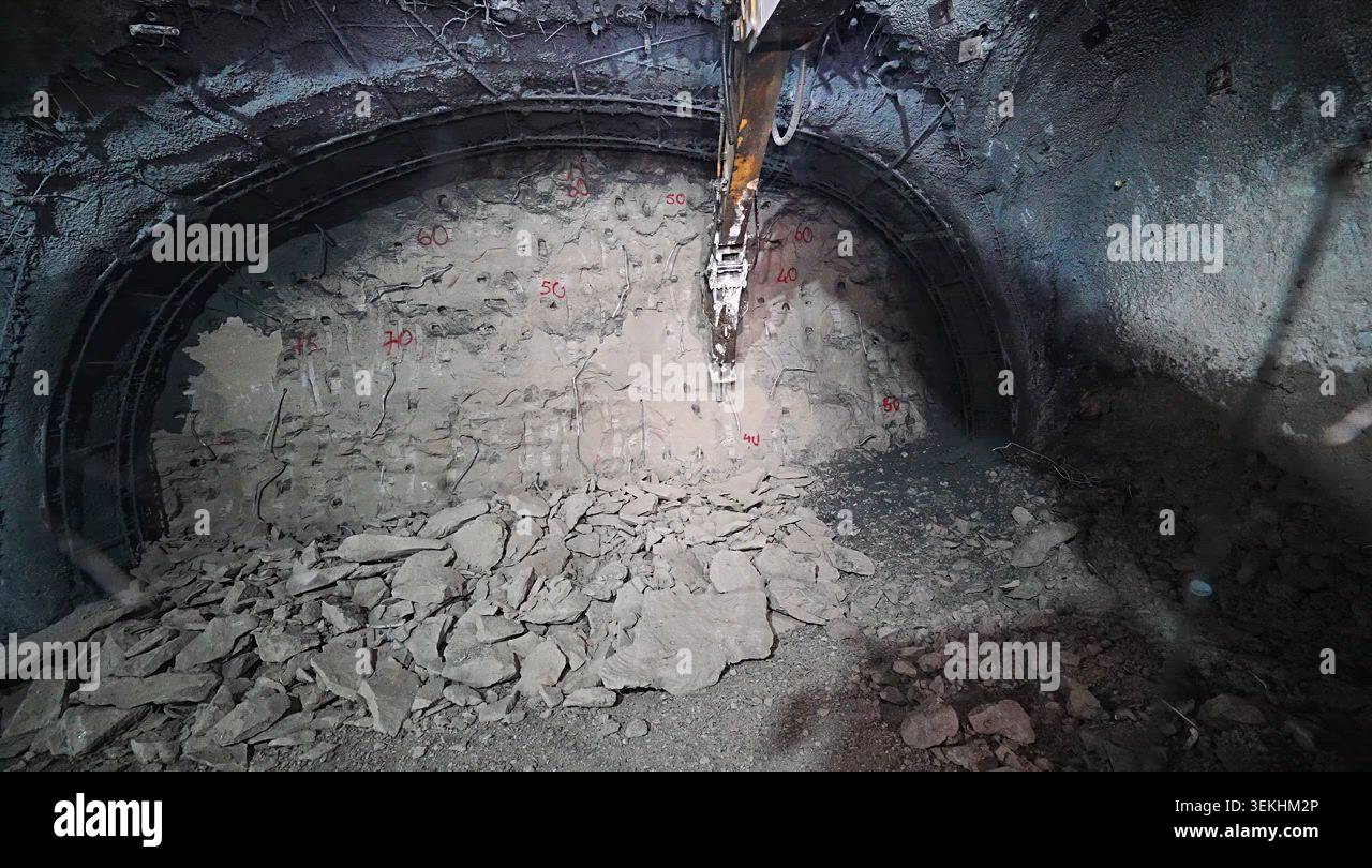 Crawler Excavator Digging Underground in Tunnel Construction Stock ...