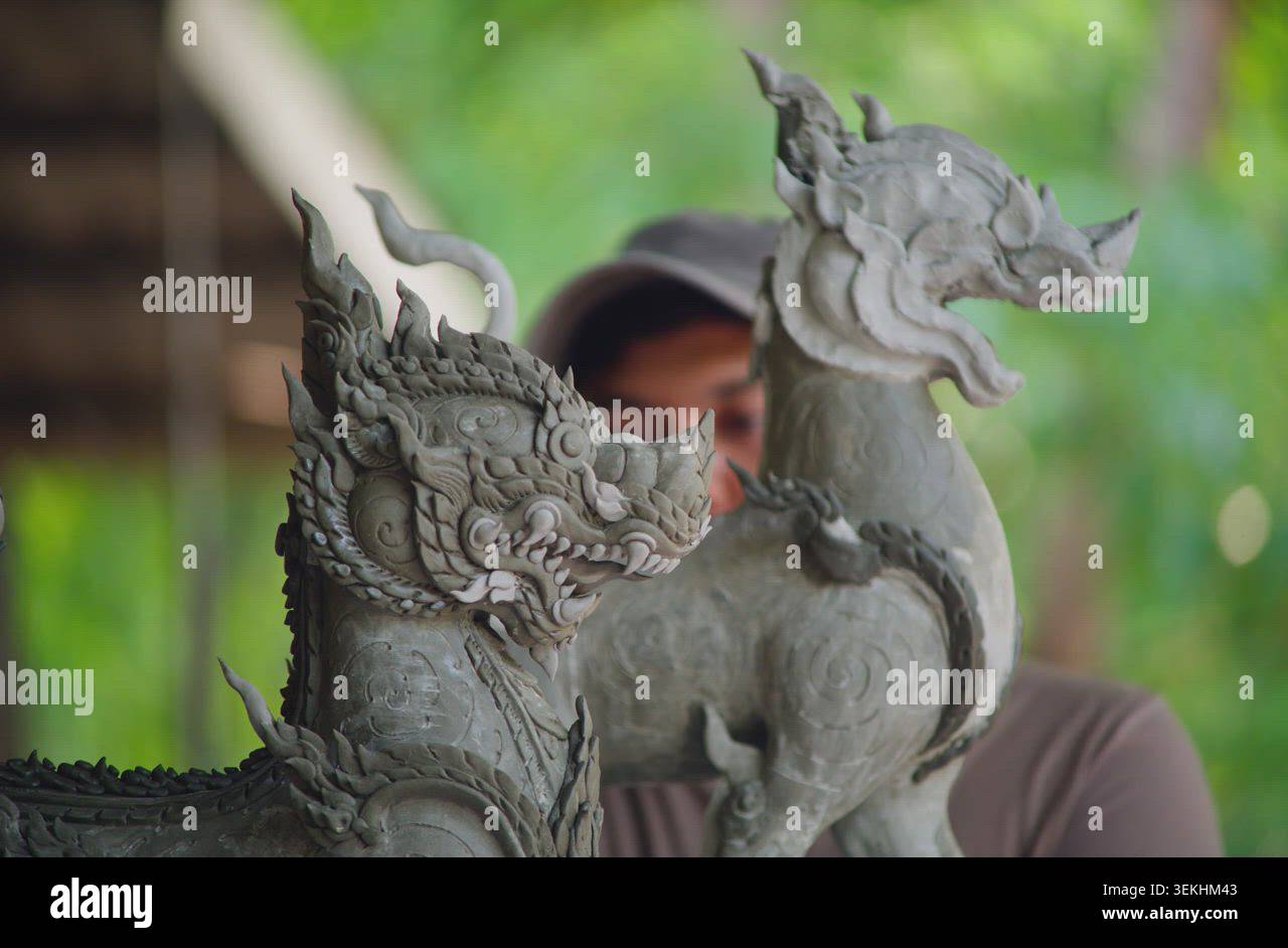 6K open gate: artisan inspecting singha cement sculpture Stock Video ...