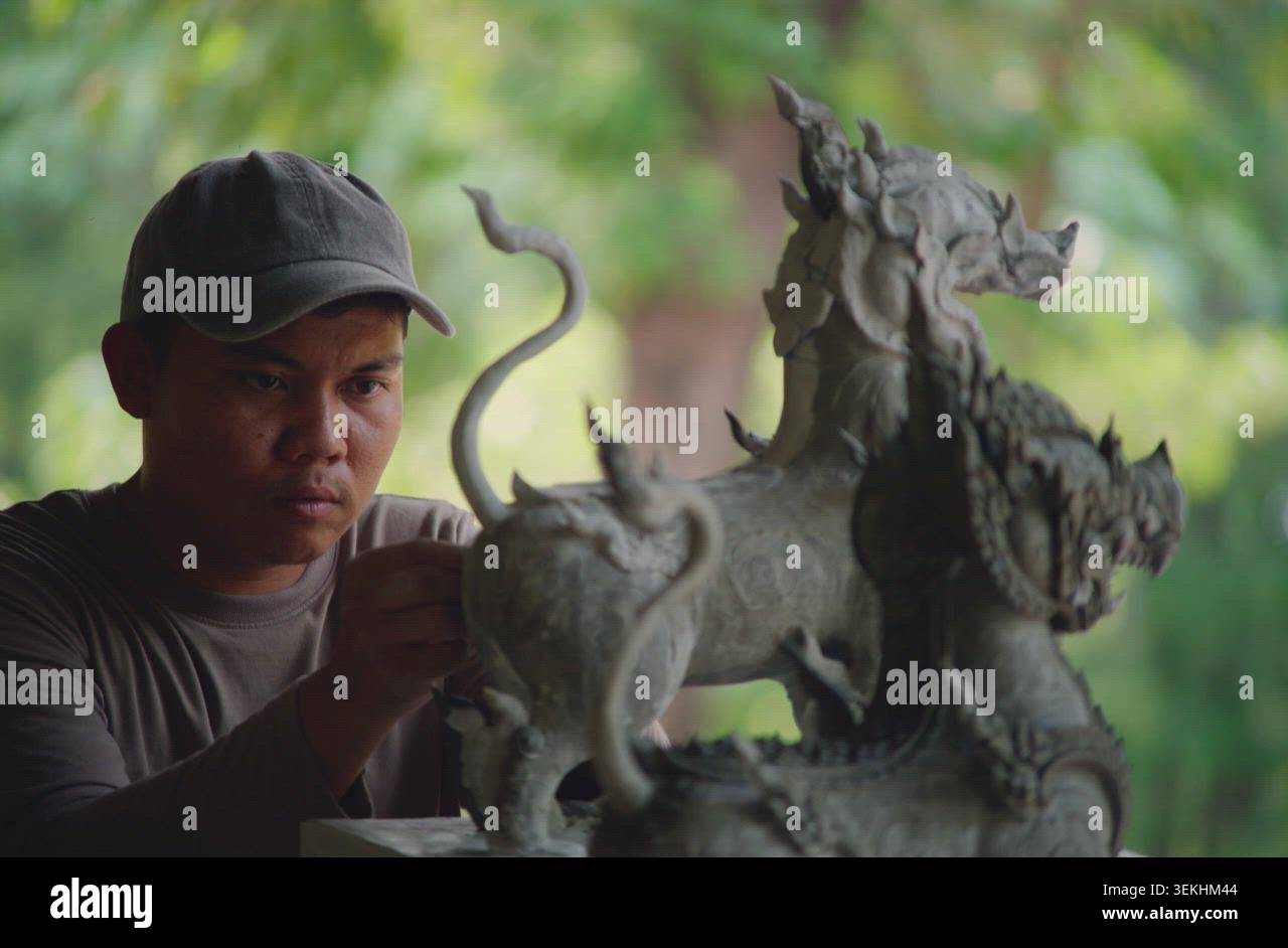 6K open gate: artisan inspecting singha cement sculpture Stock Video ...