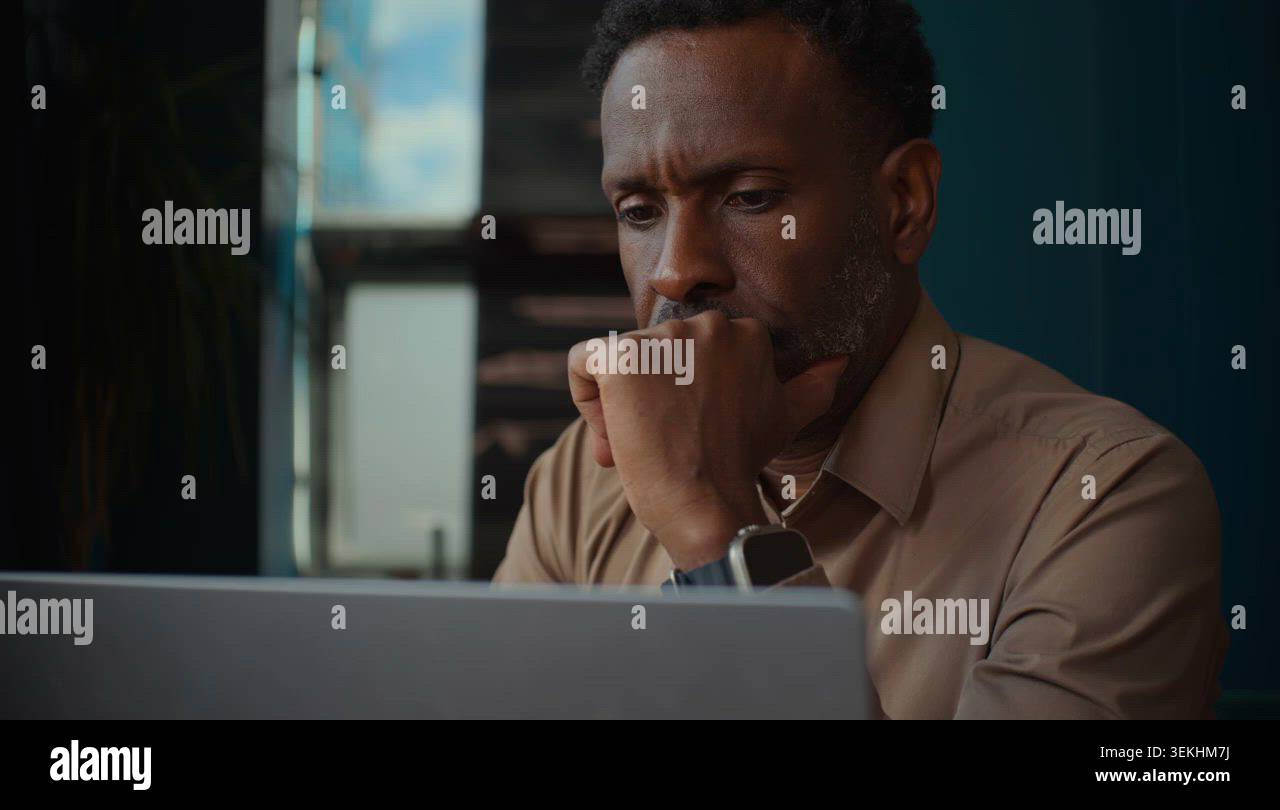 Man thinking contemplating while working on a laptop Stock Video ...