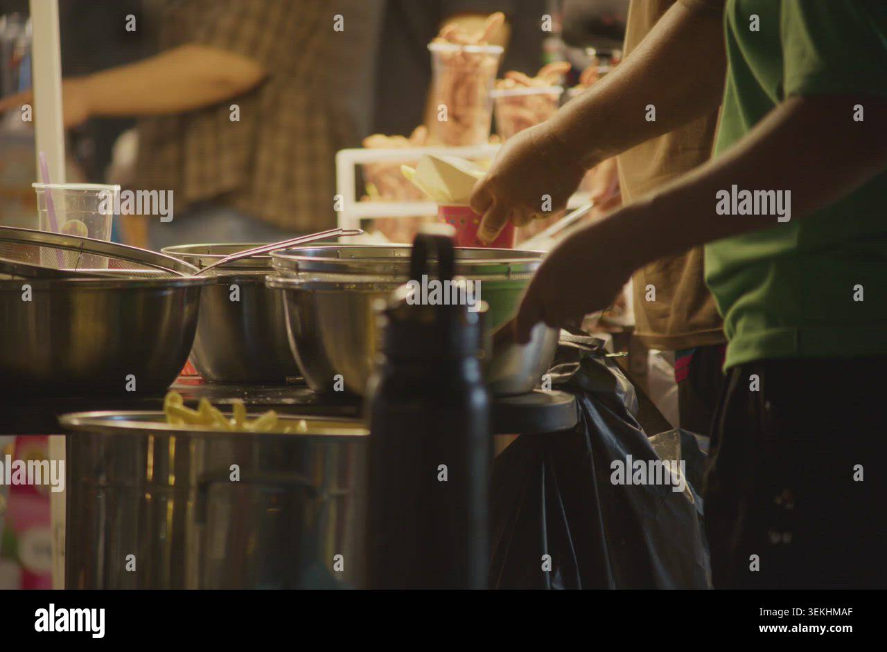 6K open gate: Frying french fries at Thai night market stall Stock ...