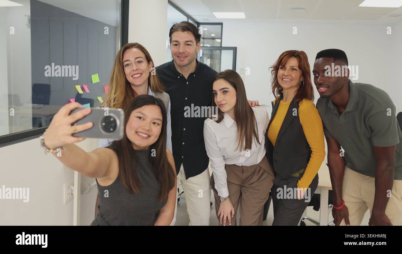 Diverse coworkers group posing for a selfie in an office Stock Video ...