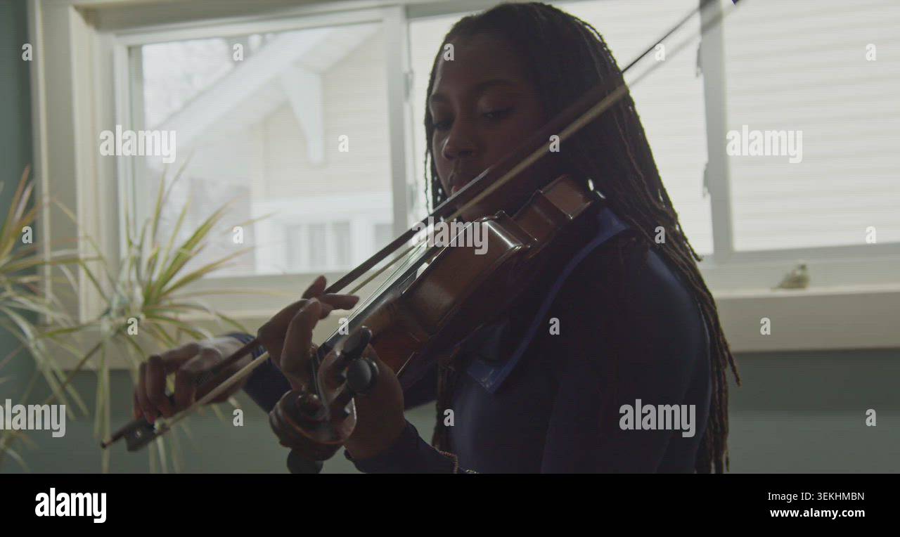 Teenage girl practicing violin Stock Video Footage - Alamy