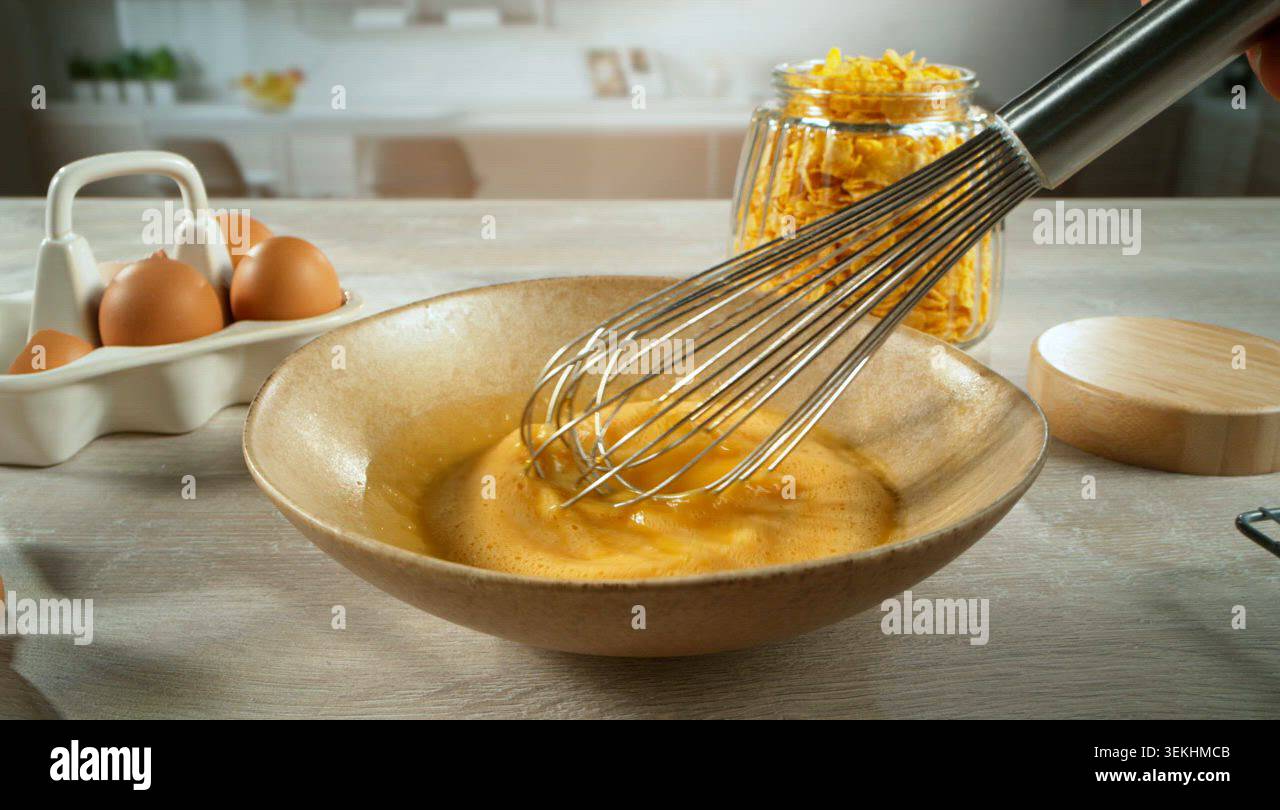 Mixing eggs and ingredients in a bowl Stock Video Footage - Alamy